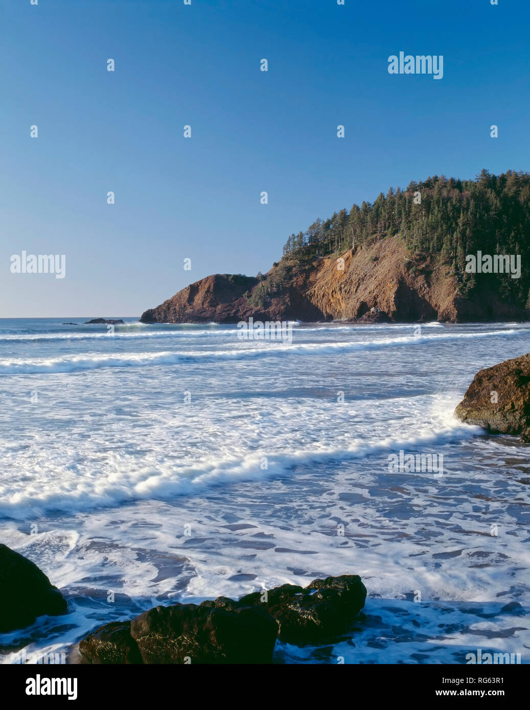 USA, Oregon, Ecola State Park, Indian Point reaches towards incoming ...
