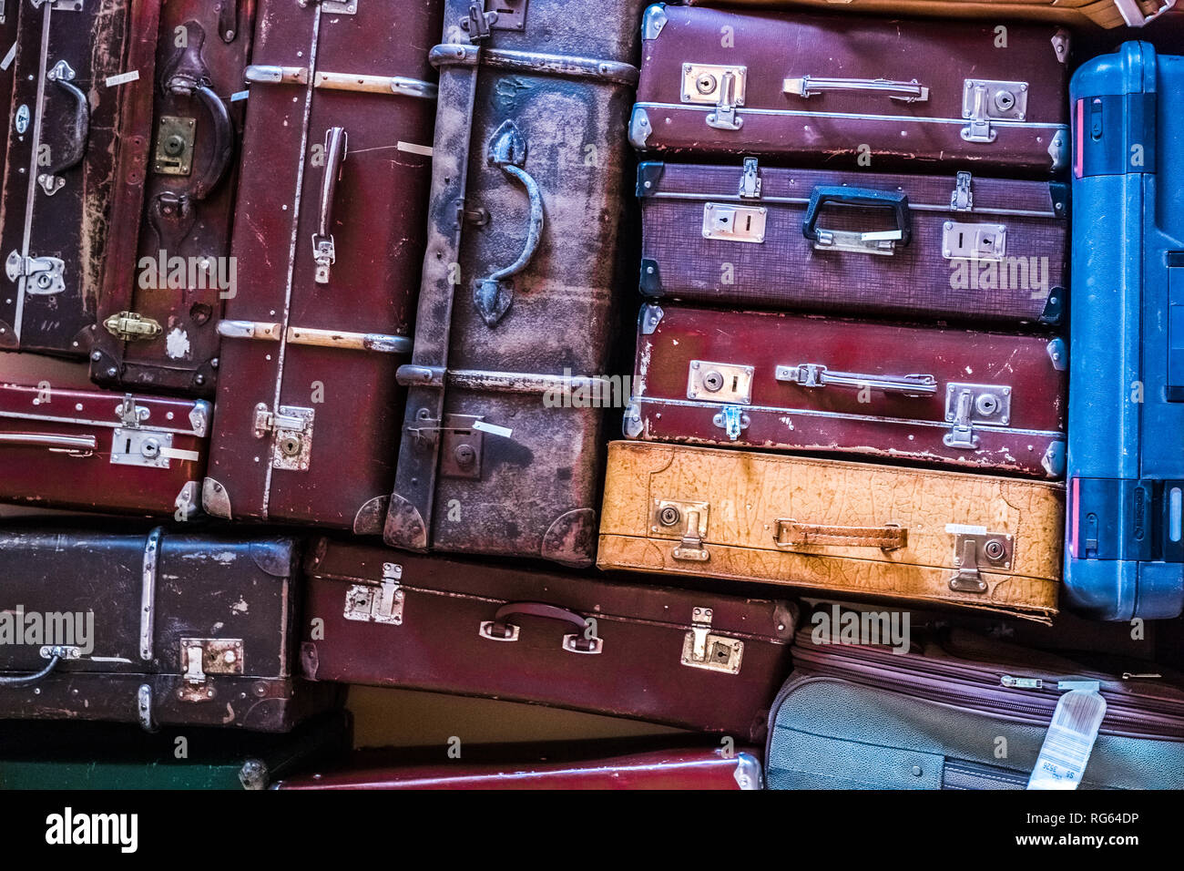 Old vintage suitcases standing in a stack, vintage background Stock ...
