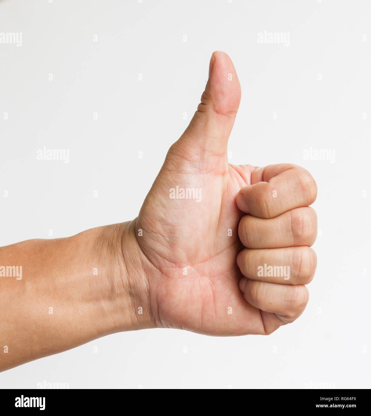Thumbs up sign from a male hand Stock Photo - Alamy