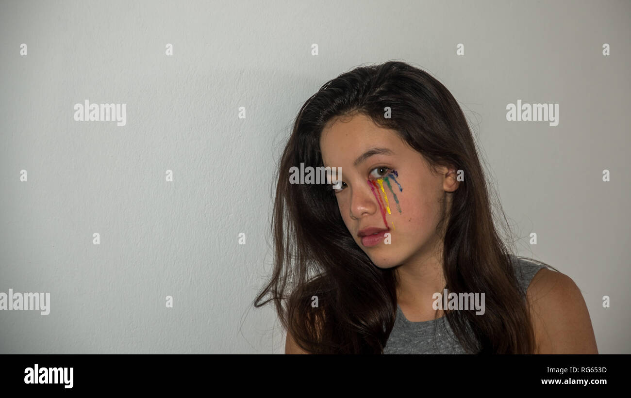 Young teen with colorful tear drops painted on her face Stock Photo - Alamy
