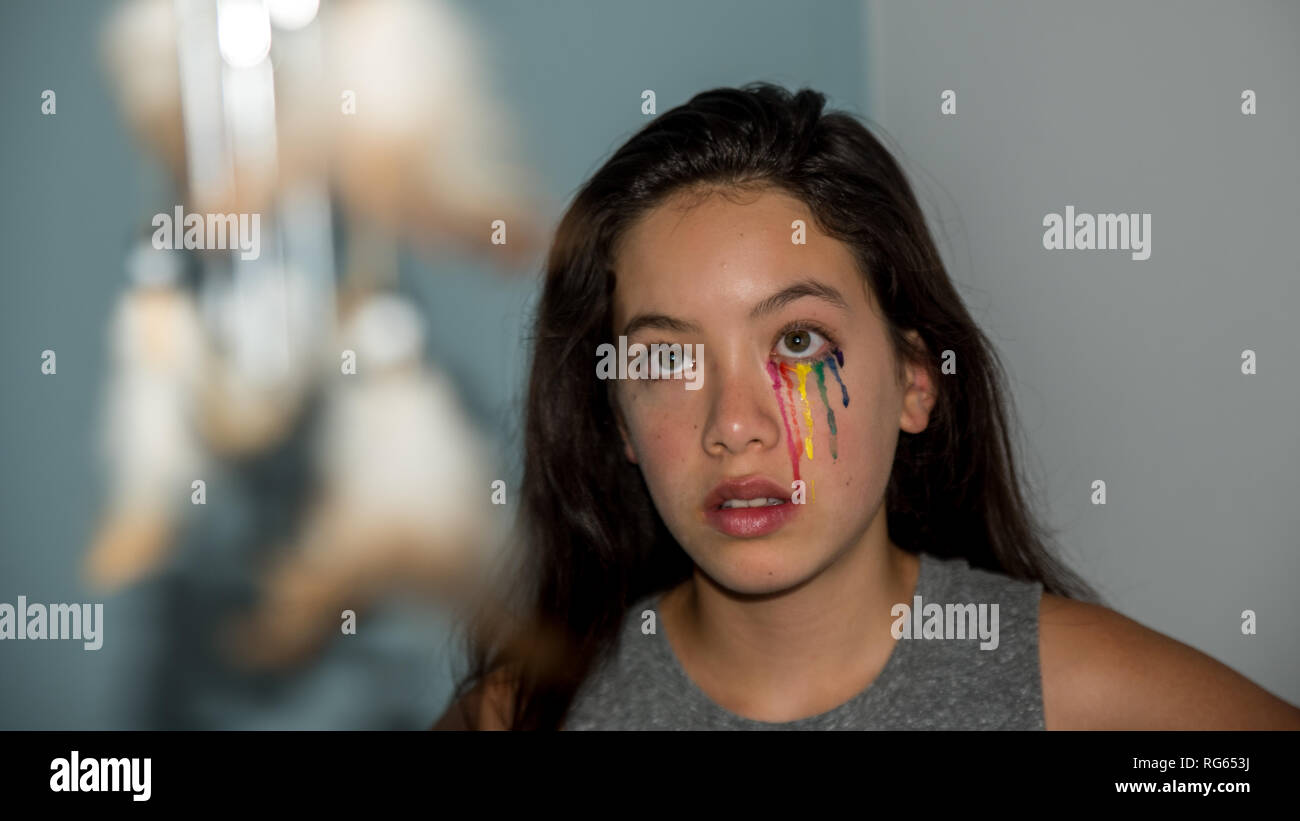 Young teen with colorful tear drops painted on her face Stock Photo - Alamy