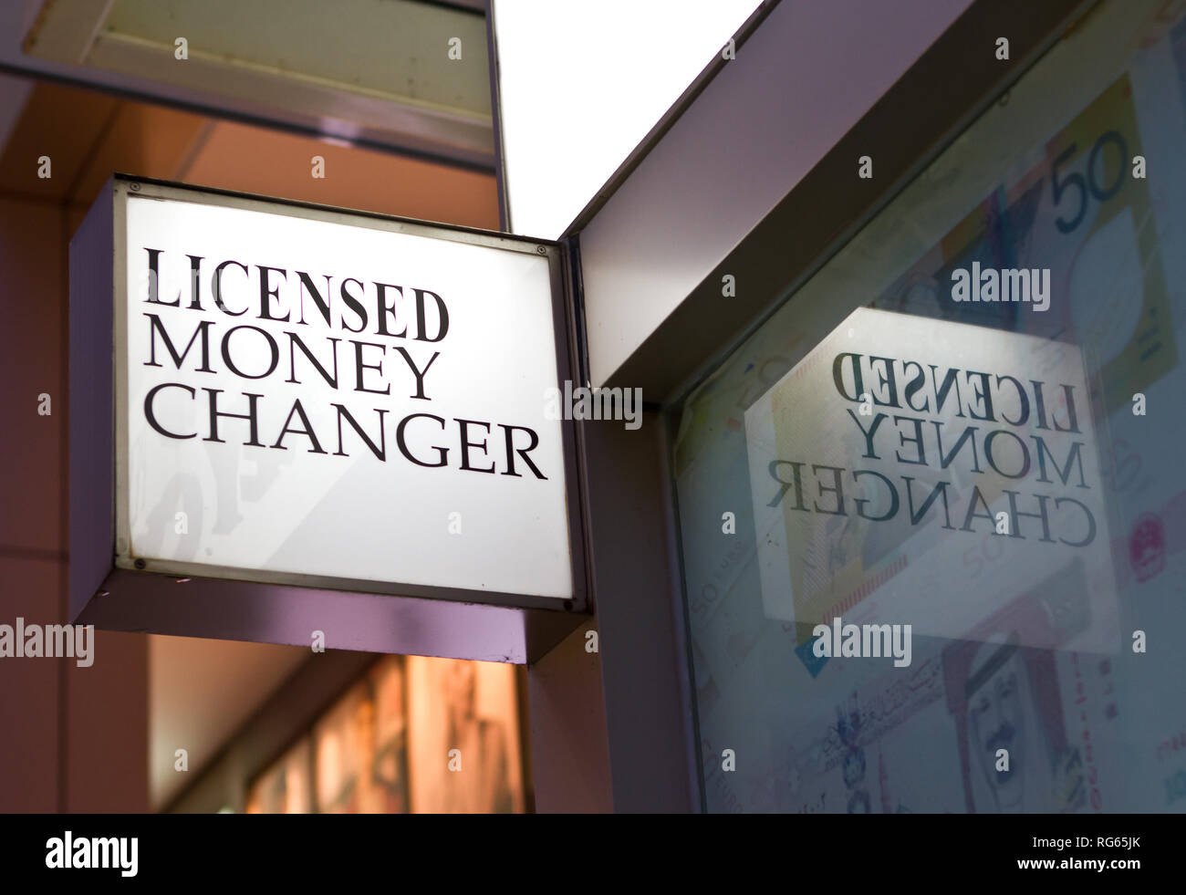 Licensed money changer sign board Stock Photo - Alamy