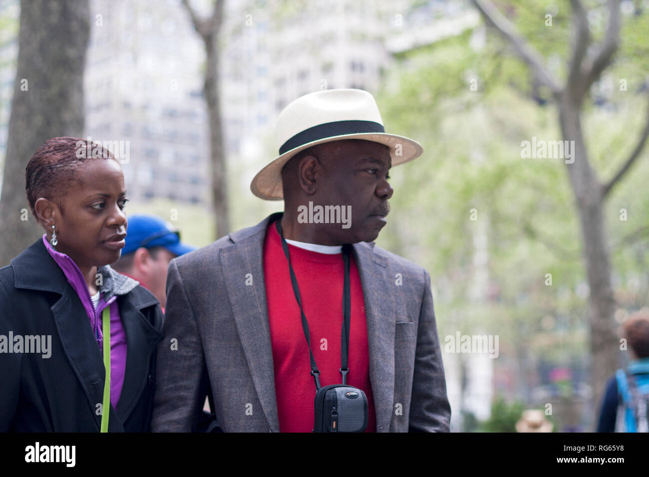 A well dressed couple walks through Bryant Park in New York City Stock ...