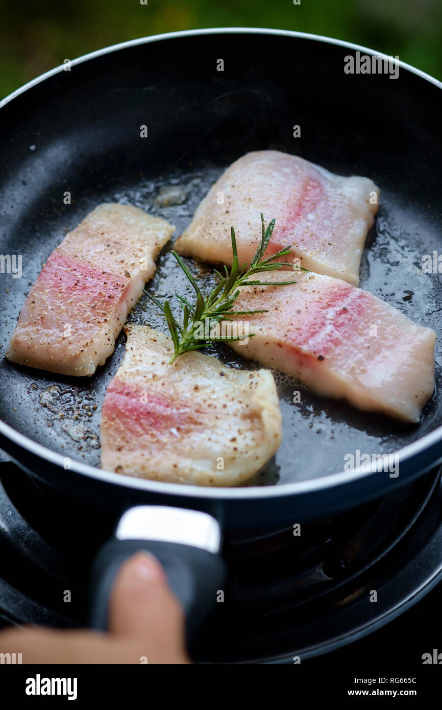 Frying fish hi-res stock photography and images - Alamy