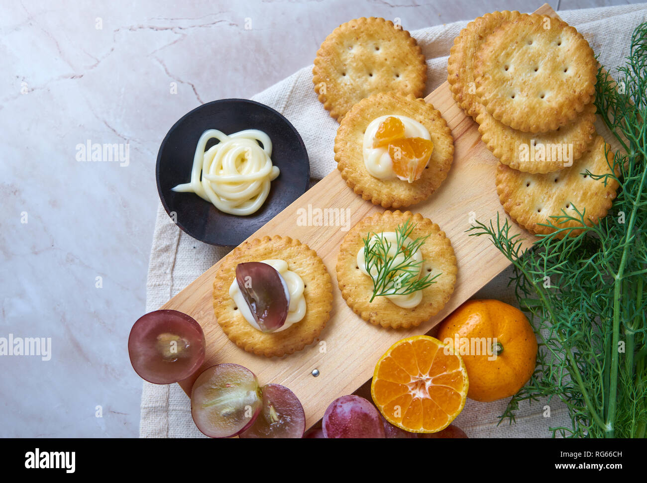 Biscuit Canape serving on wooden board Stock Photo - Alamy