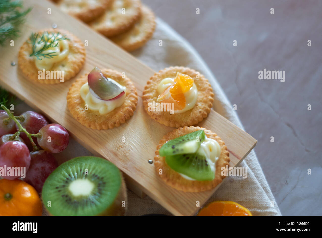 Biscuit Canape serving on wooden board Stock Photo - Alamy
