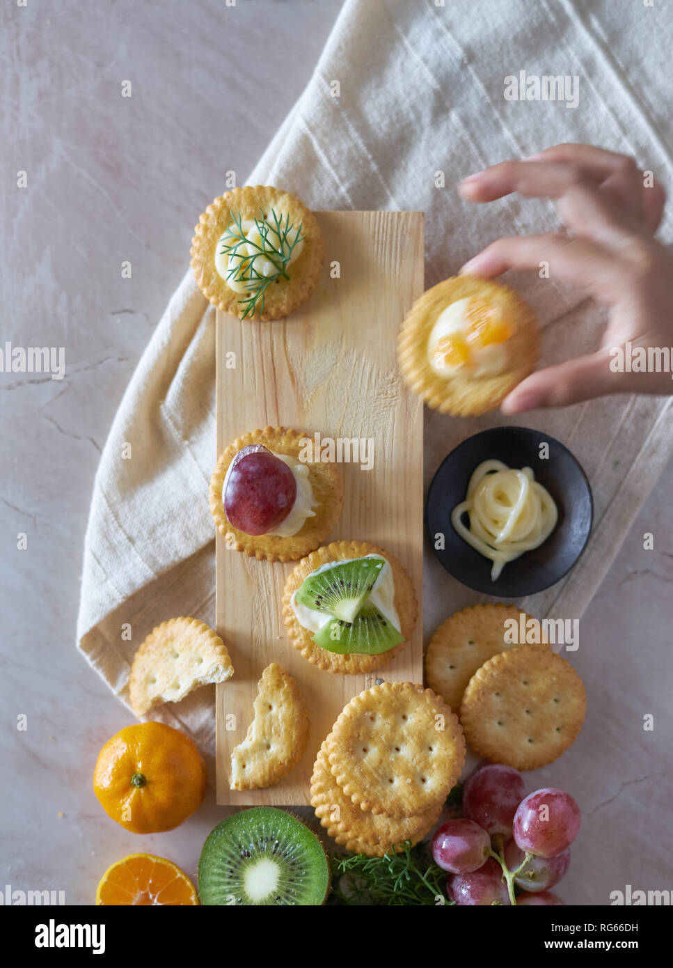 Biscuit Canape serving on wooden board Stock Photo - Alamy