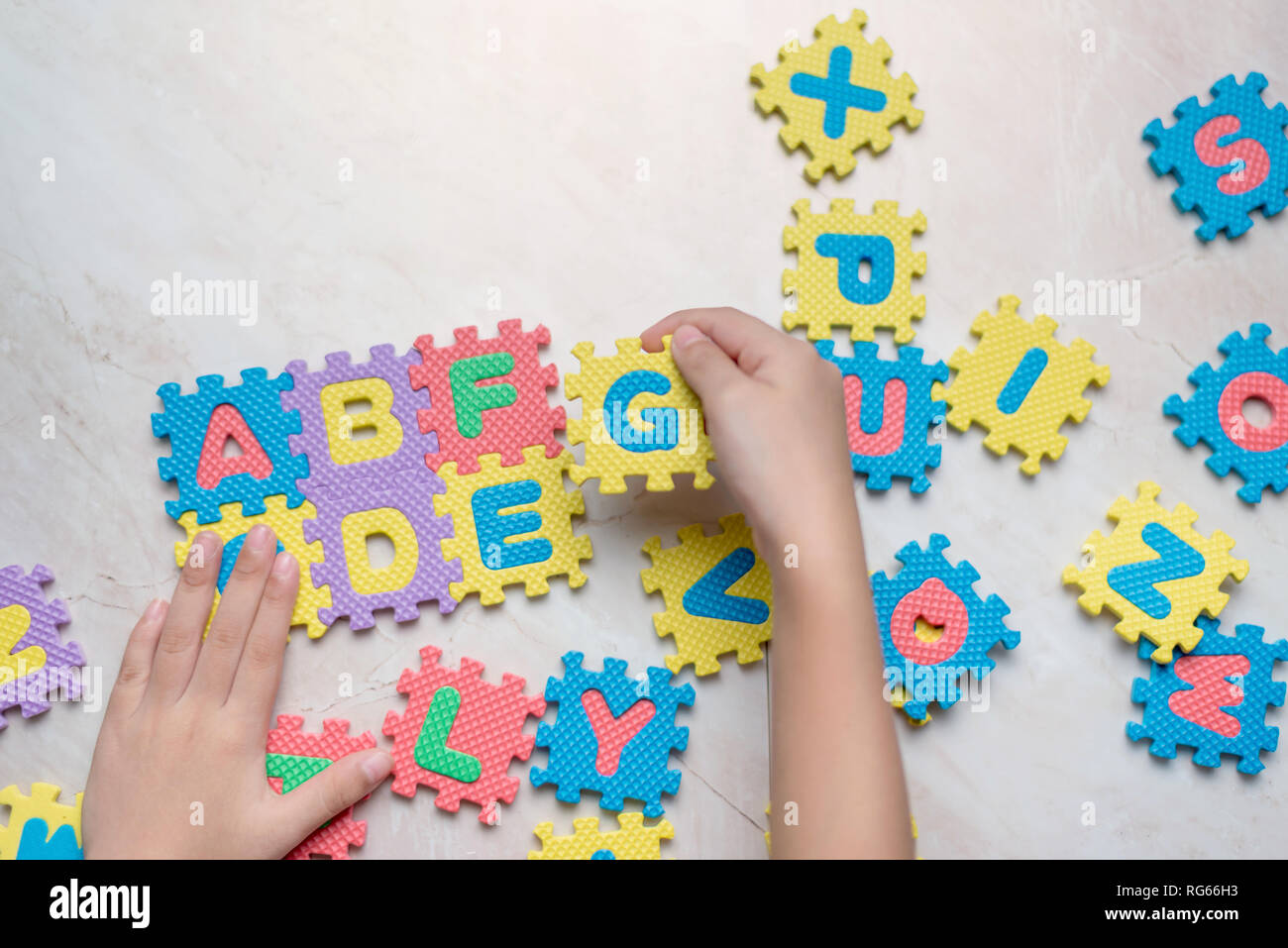 Child play alphabet puzzle Stock Photo - Alamy