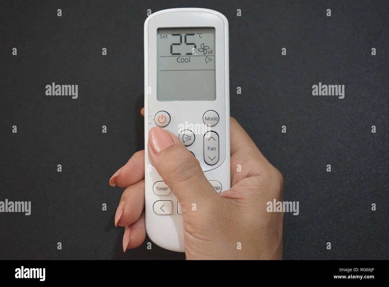Set temperature in remote control of air conditioner Stock Photo - Alamy