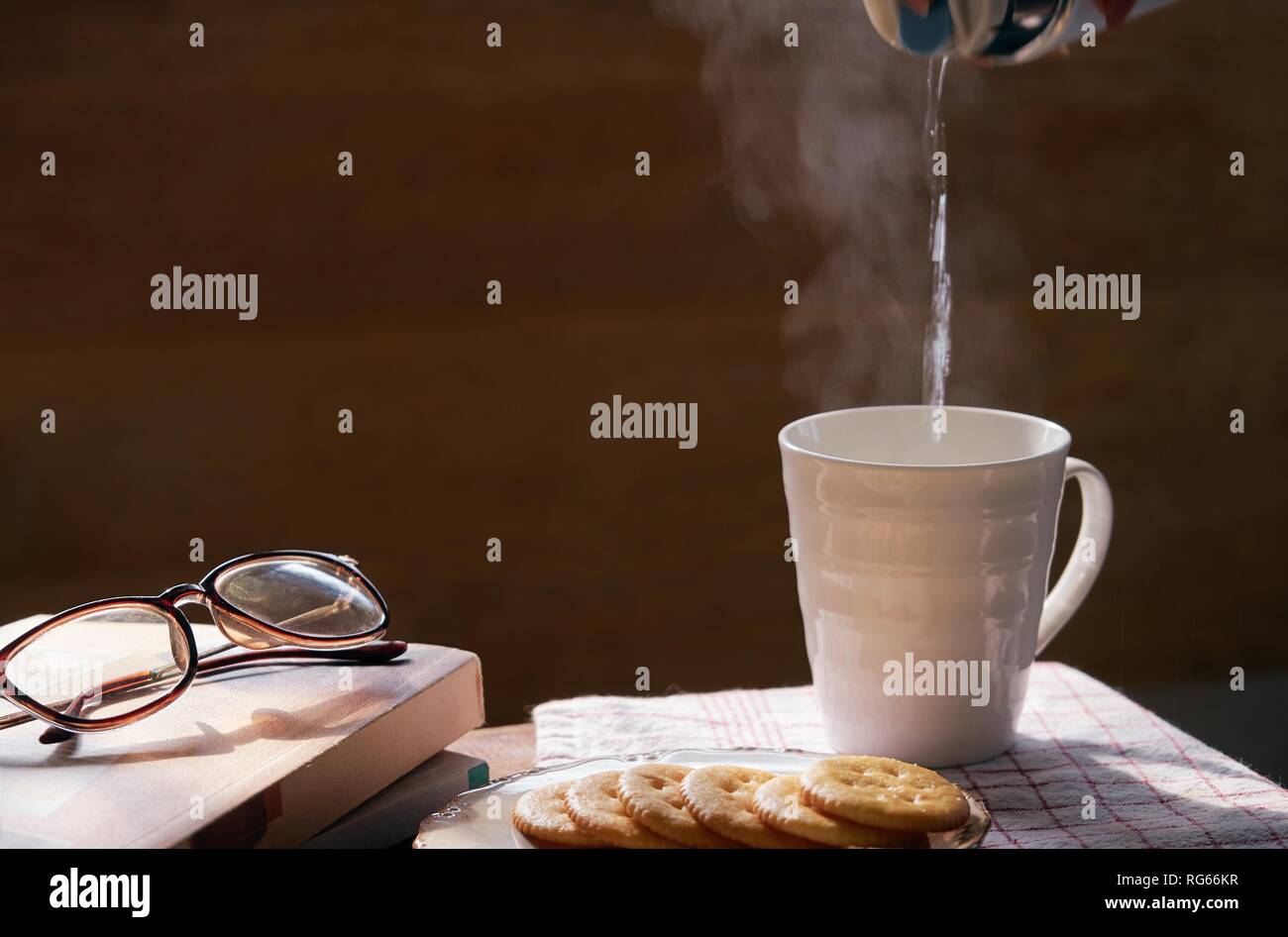 Pouring hot water into cup Stock Photo - Alamy