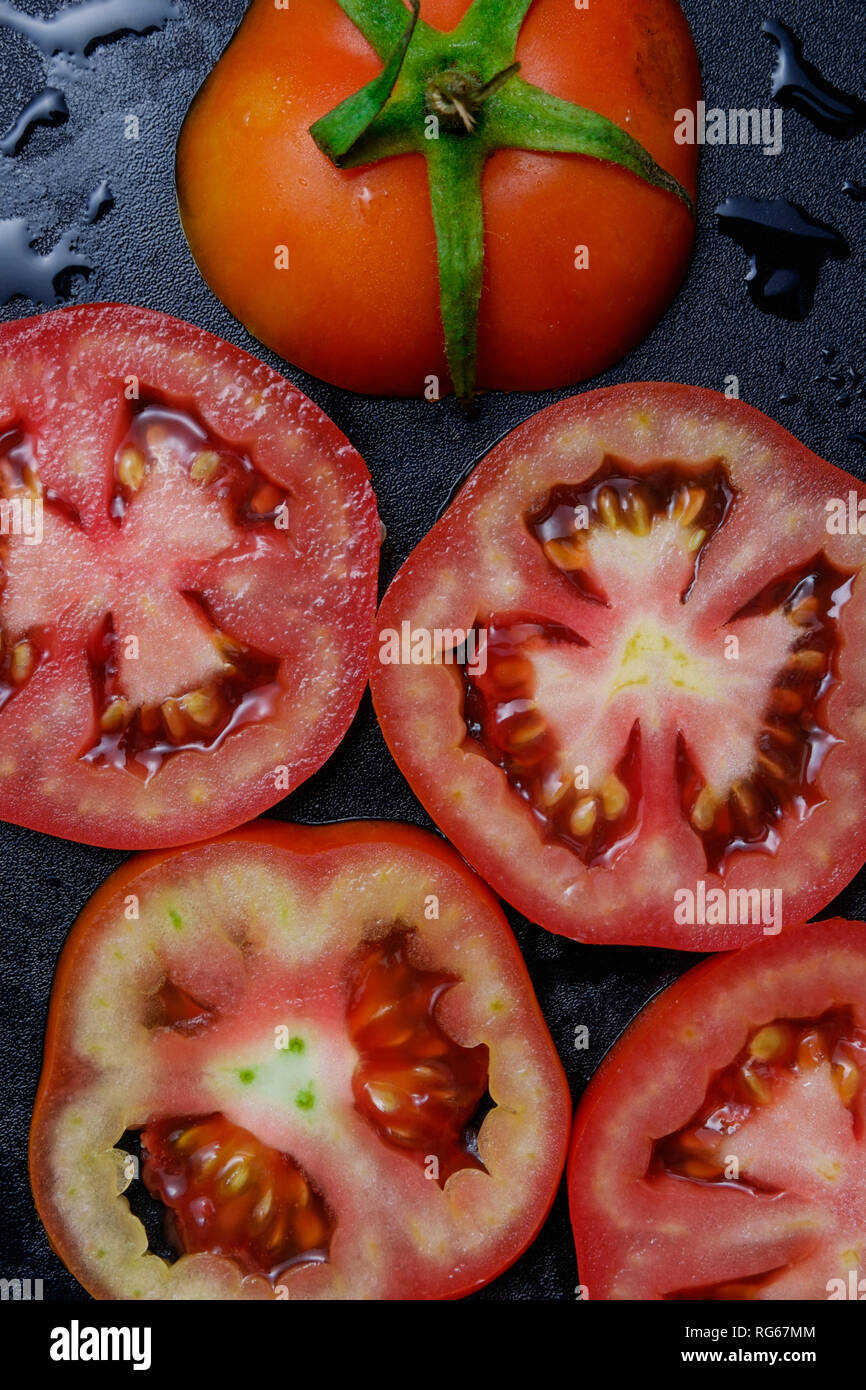 Sliced red and juicy tomato Stock Photo - Alamy