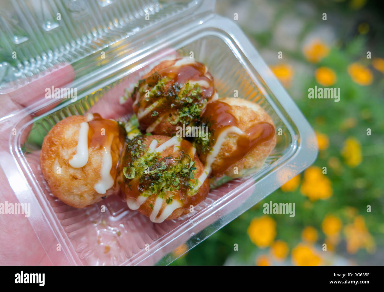 Takoyaki in plastic box Stock Photo - Alamy
