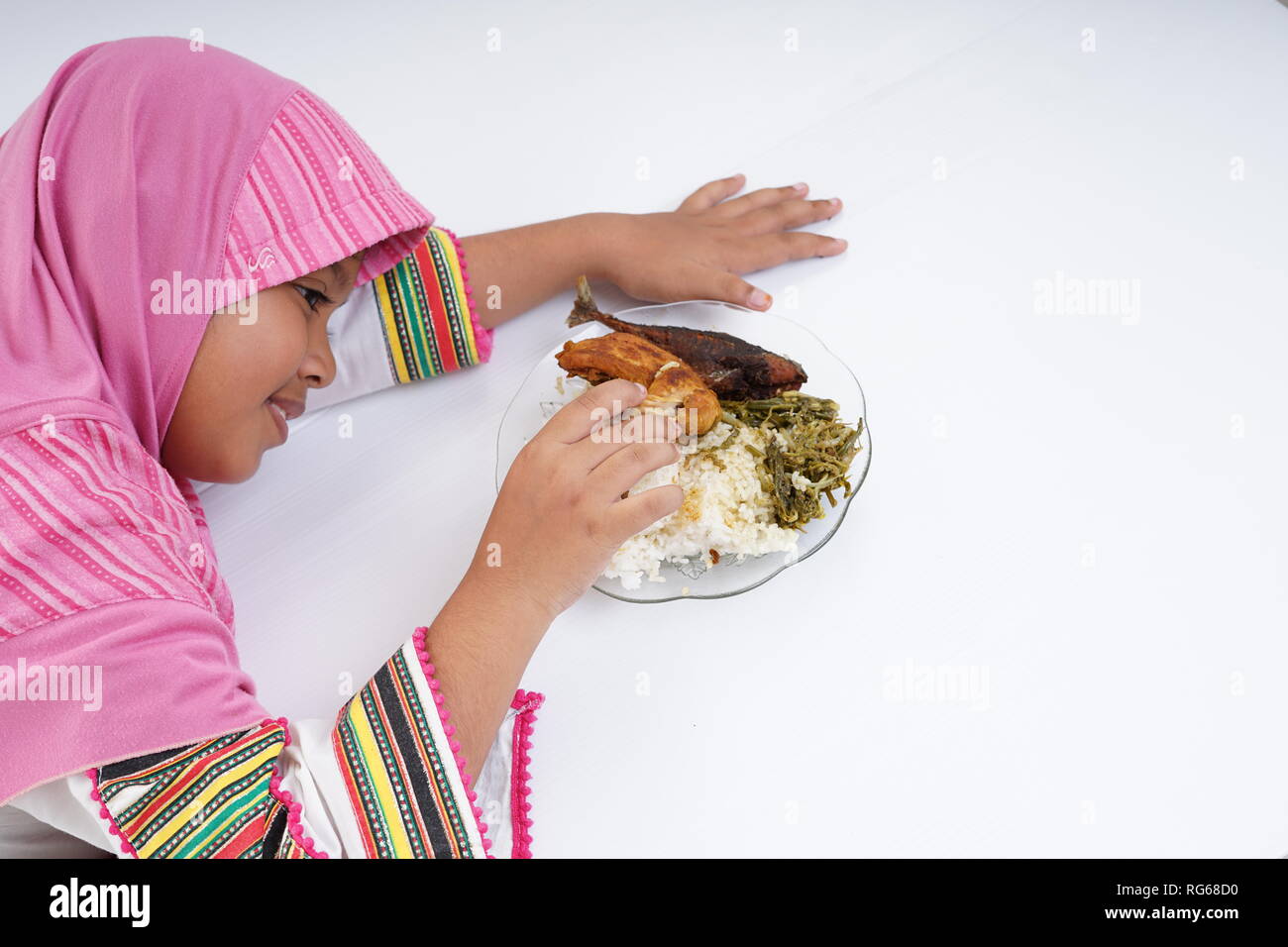 Teenage Asian girl kid getting bored of food meal with appetite loss ...
