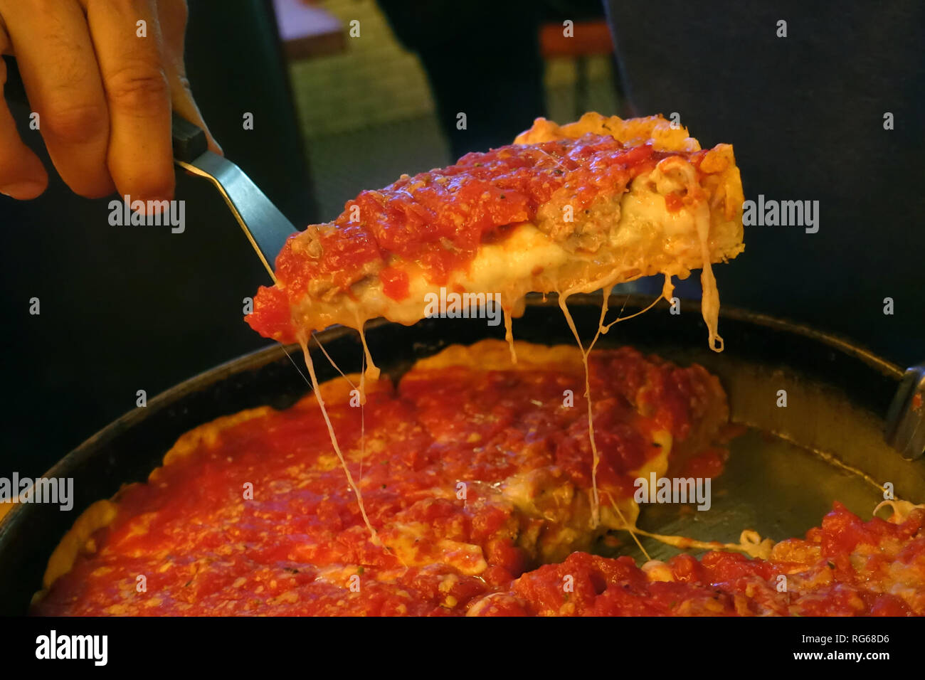 A large deep dish cheese pizza Stock Photo - Alamy