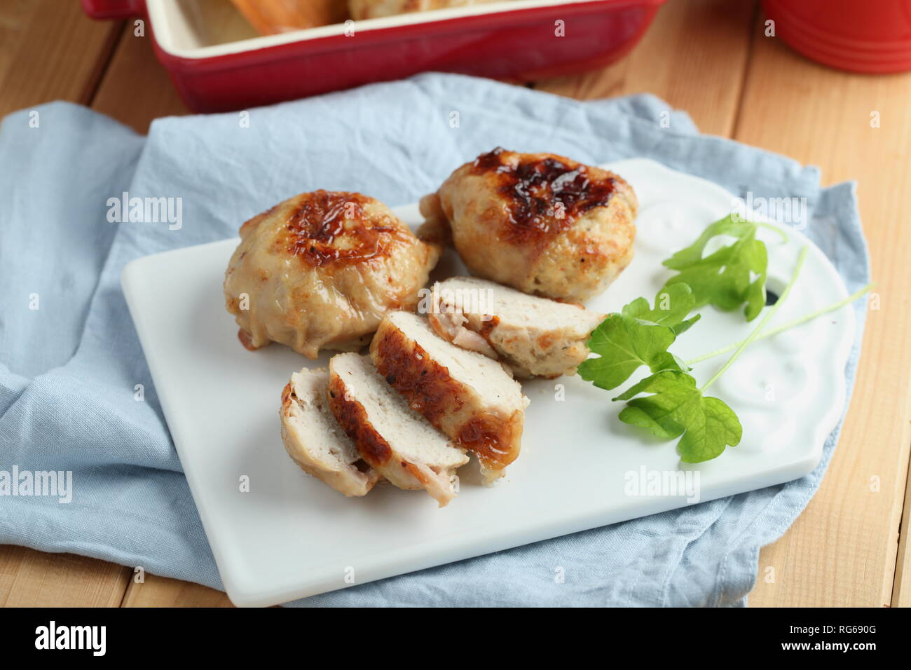Whole and sliced chicken galantines and parsley Stock Photo - Alamy