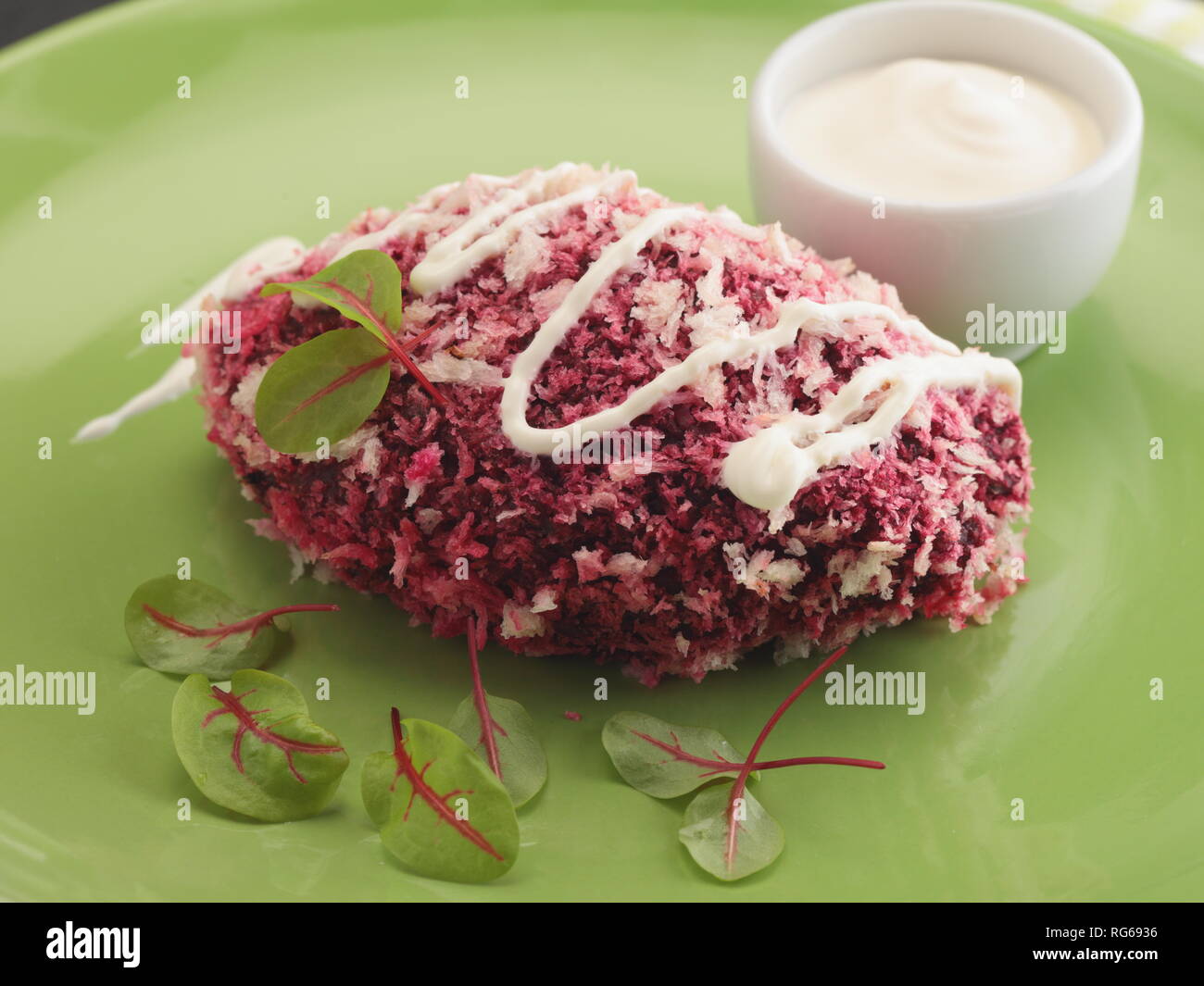 Vegan beet patty with sour cream and red chard Stock Photo - Alamy