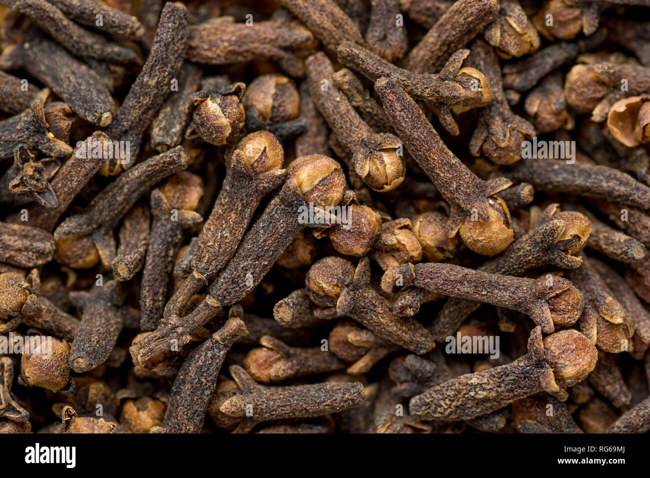 Freshly dryed clove spice texture close up. Top view Stock Photo - Alamy