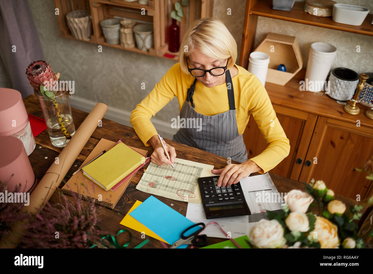 Mature Woman Accounting Stock Photo - Alamy