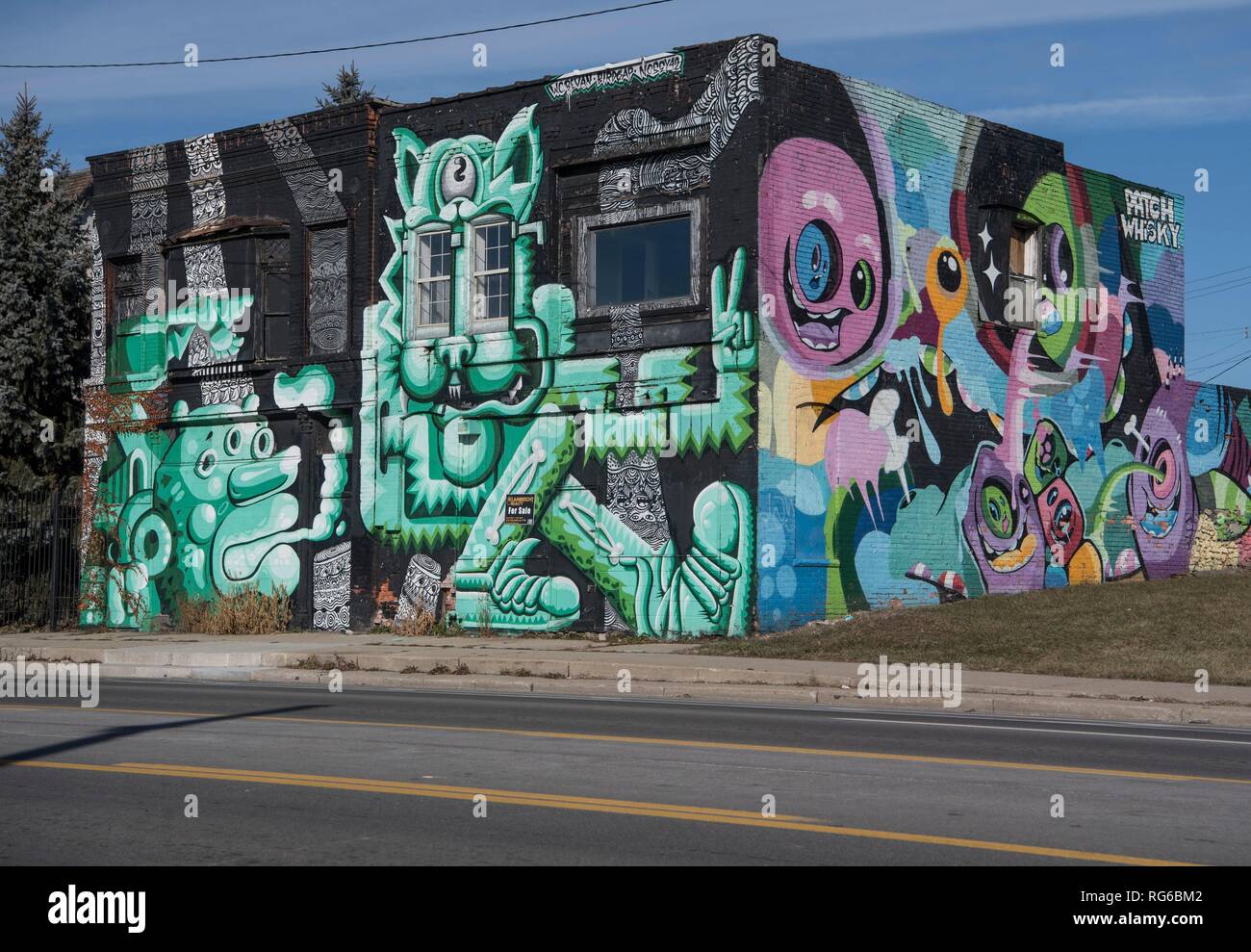 Completely painted with huge graffiti, this house facade is on an ...