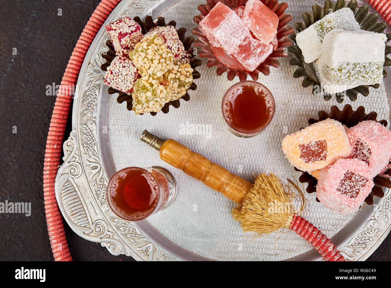 Set of various Turkish delight in traditional silver bowl on metal tray ...