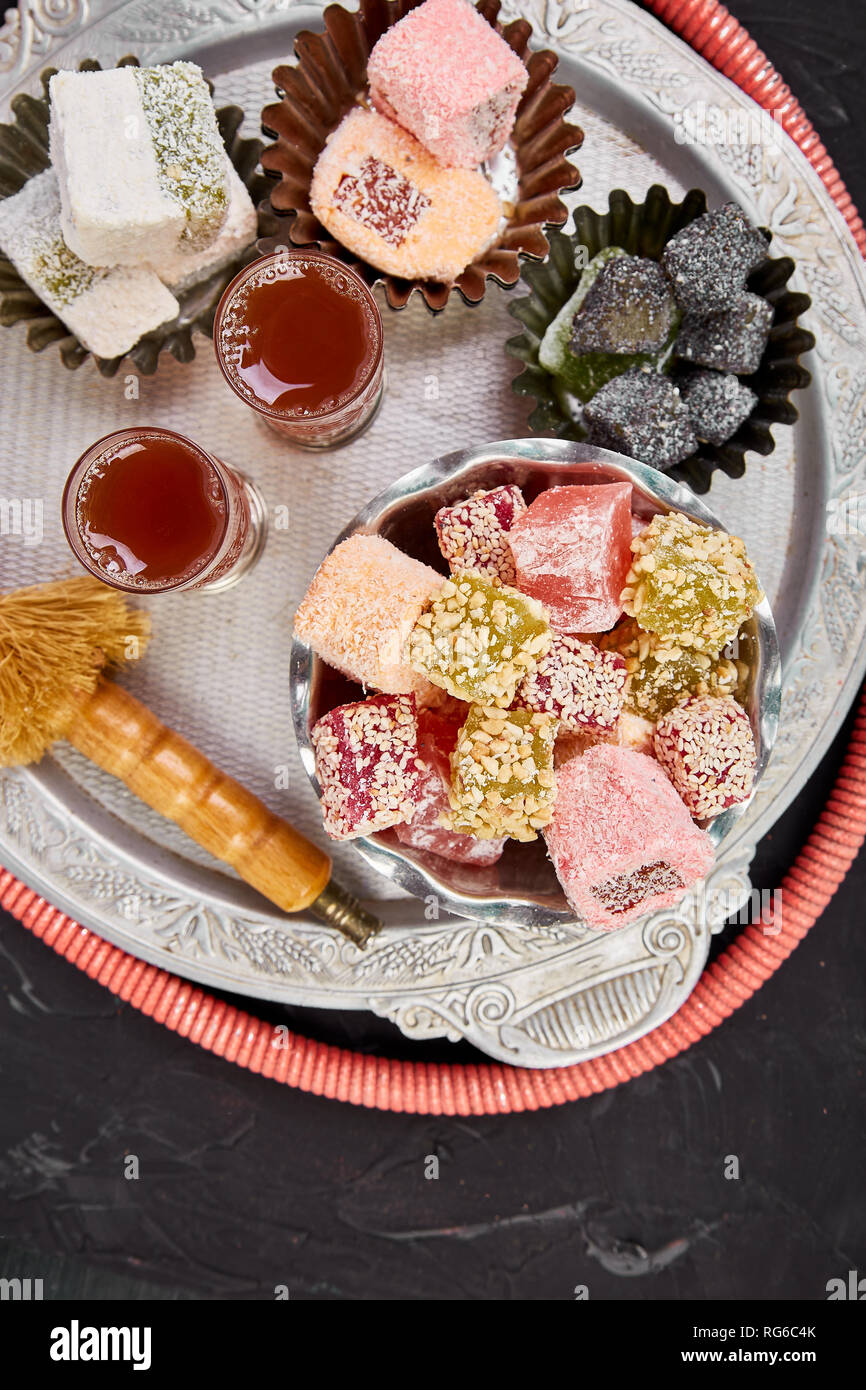 Set of various Turkish delight in traditional silver bowl on metal tray ...