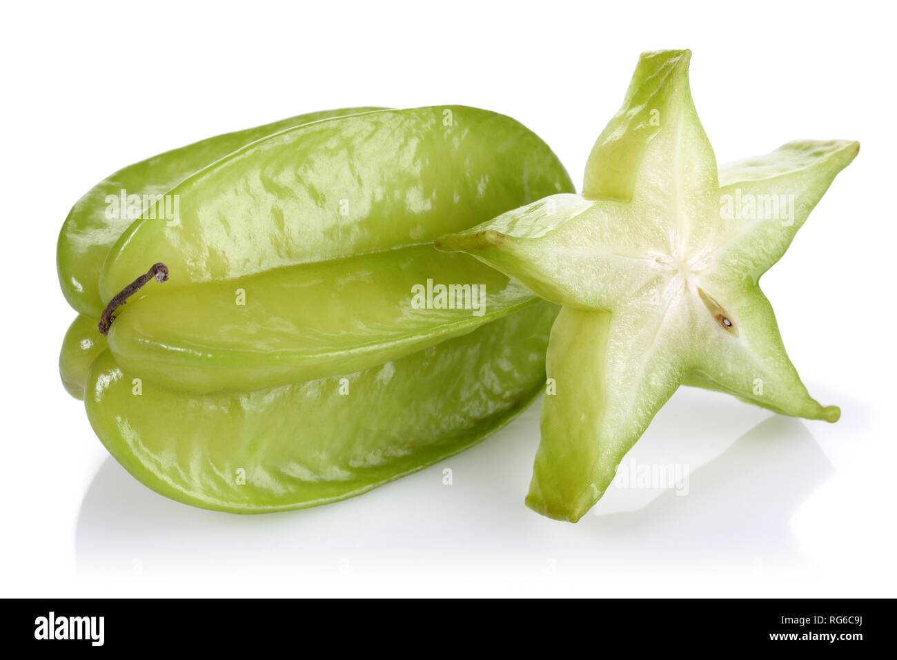 Fresh whole Star fruit and slice on white background Stock Photo - Alamy