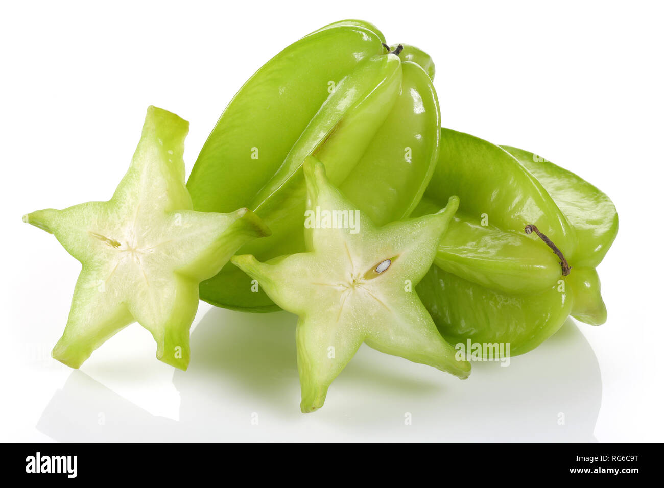 Fresh whole Star fruit and slices on white background Stock Photo - Alamy