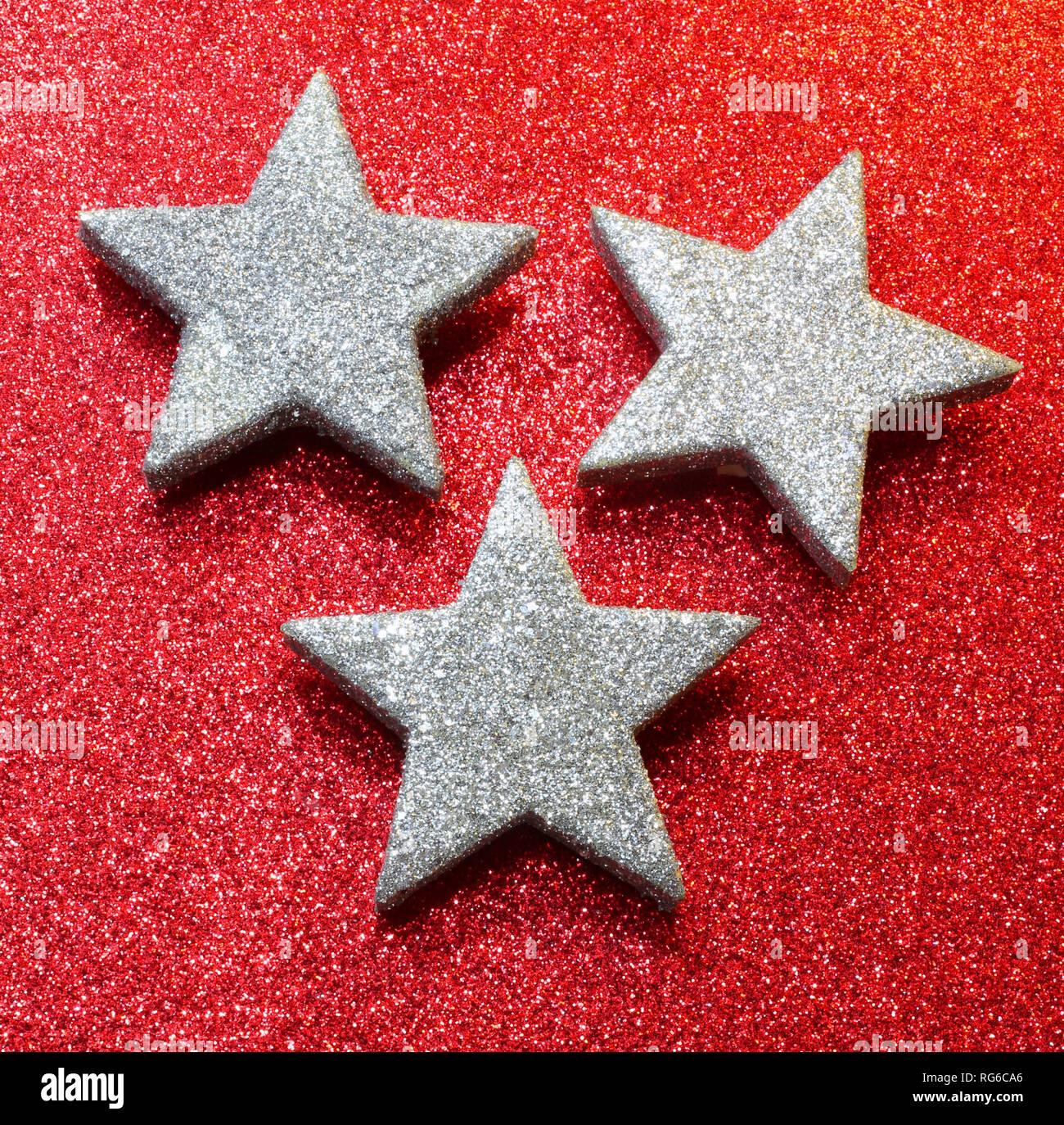 large silver stars on bright red glittery illuminated background Stock ...