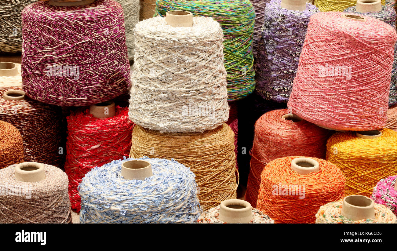 many coils and spools of fine colored wool thread for the creation ...