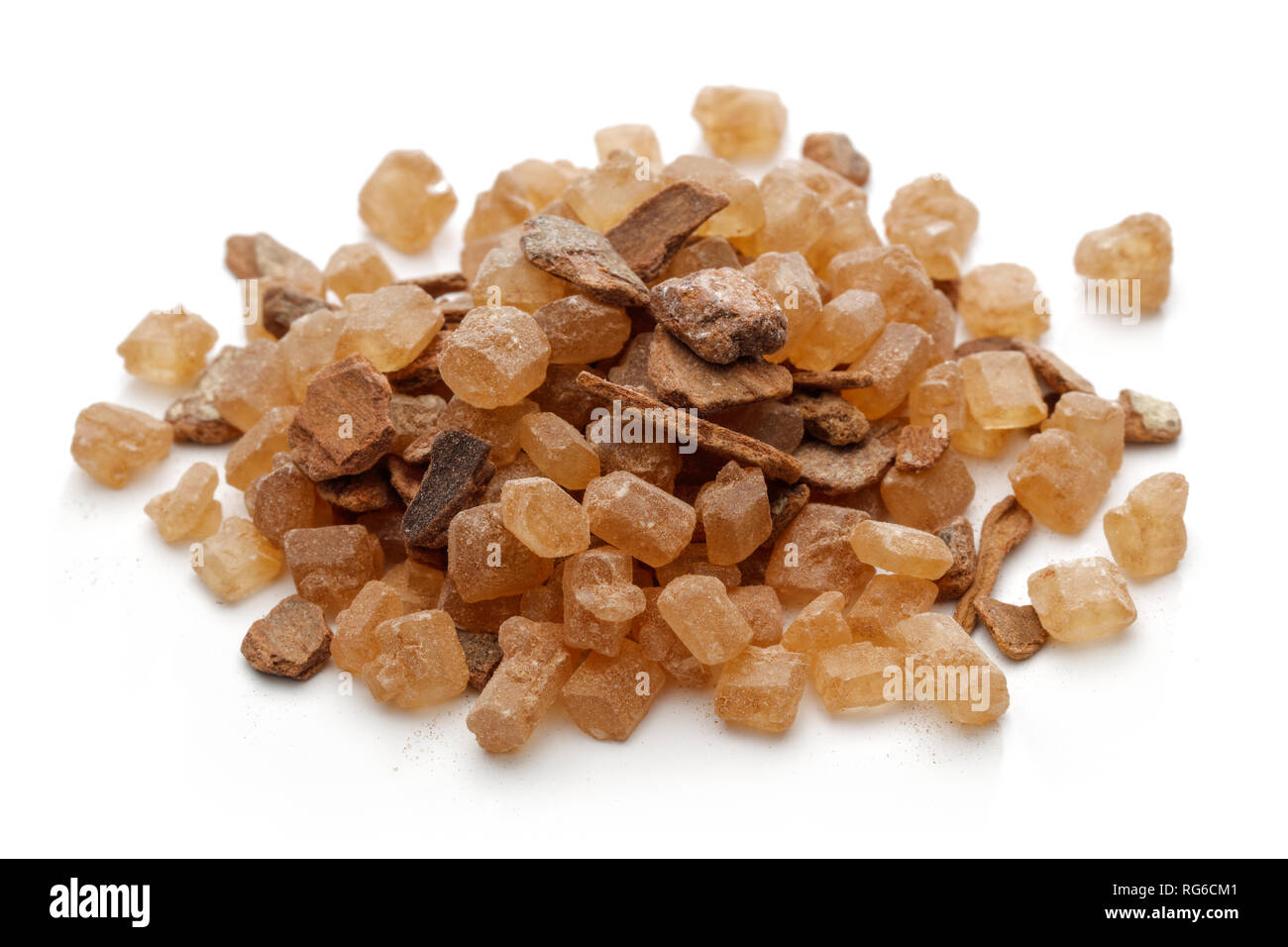 Heap of cinnamon pieces in sugar grains on white background Stock Photo ...