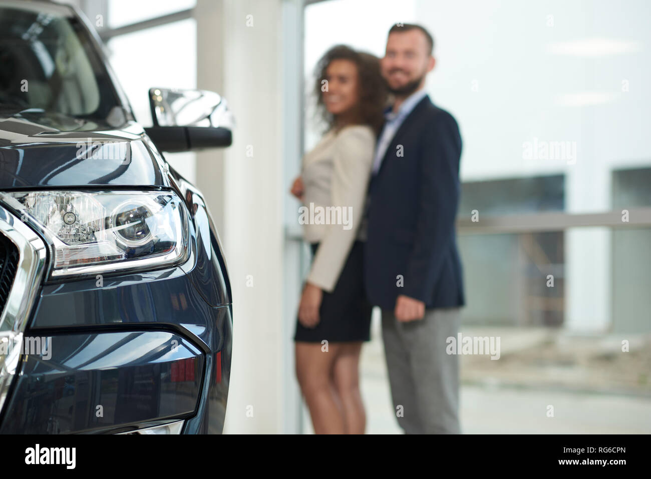 Man standing behind car hi-res stock photography and images - Alamy