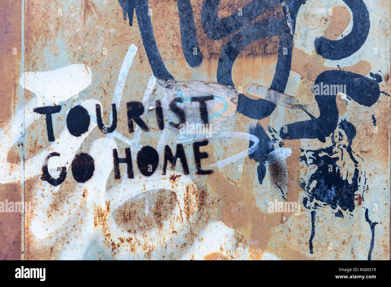 "Tourist go home", graffiti on rusty metal surface; Copenhagen, Denmark ...