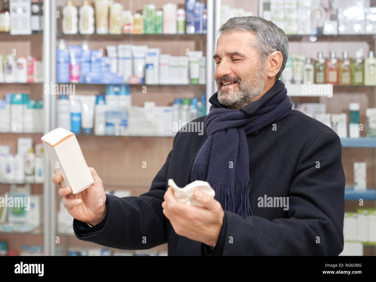 Happy customer of drugstore choosing medicaments for health care ...