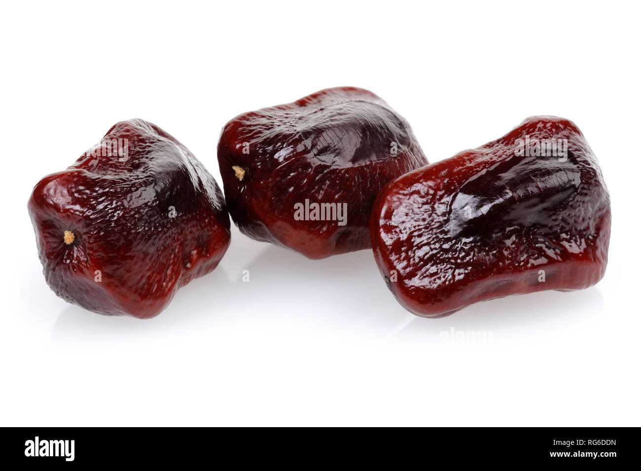 Tamarind seeds isolated on white background Stock Photo - Alamy