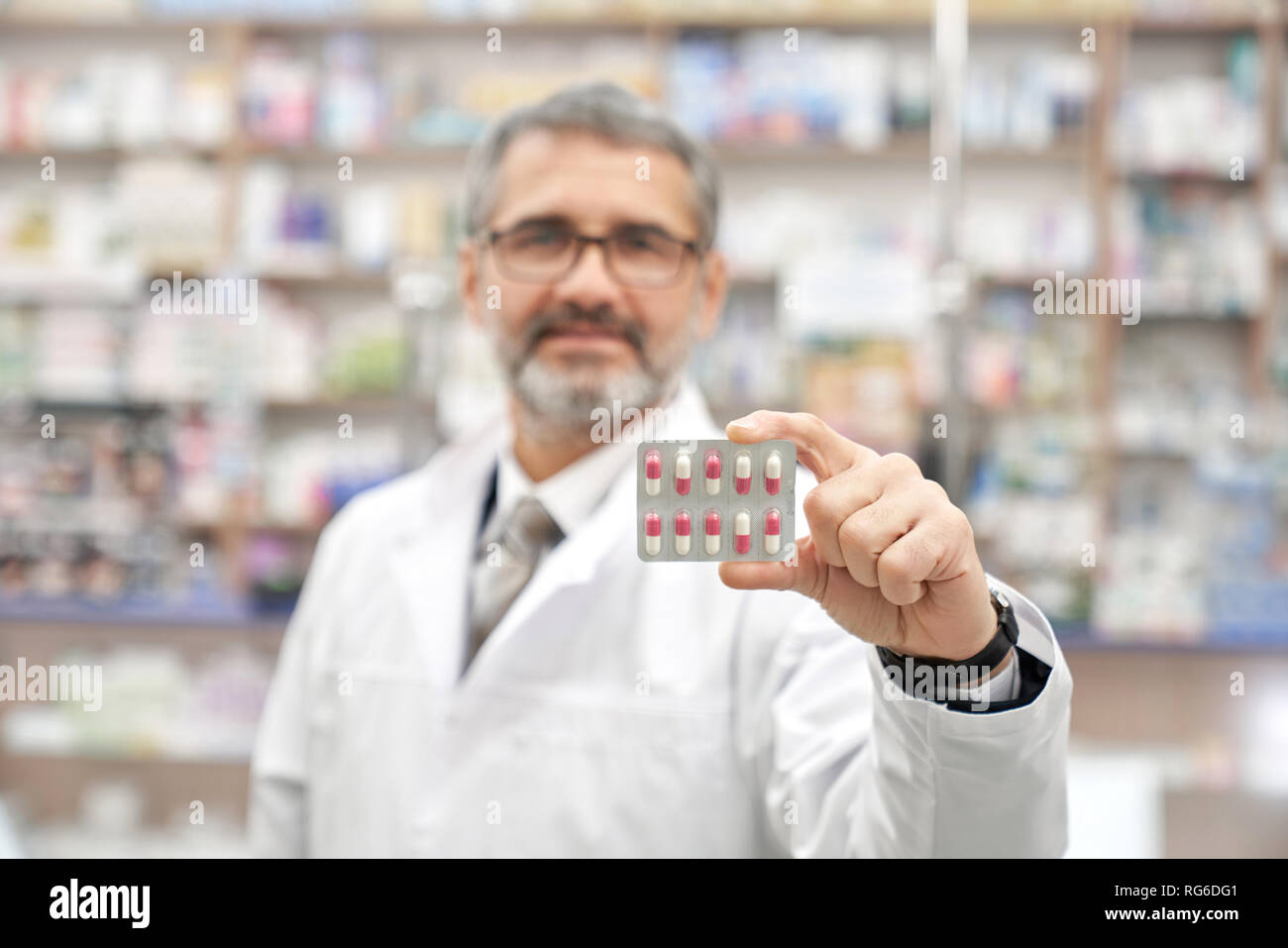 Chemist holding medicaments in hand, showing. Close up of blister pack ...