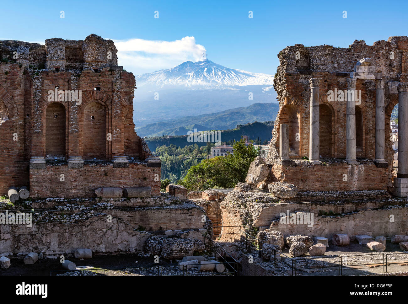 Volcano Etna seen through ruins of ancient Greek amphitheater in ...