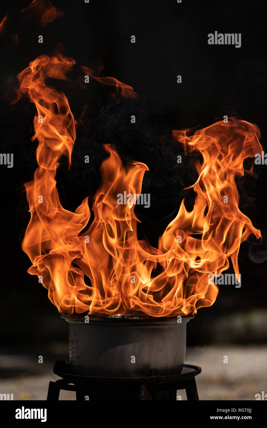 Closeup Fire flames from pot while cooking Stock Photo - Alamy