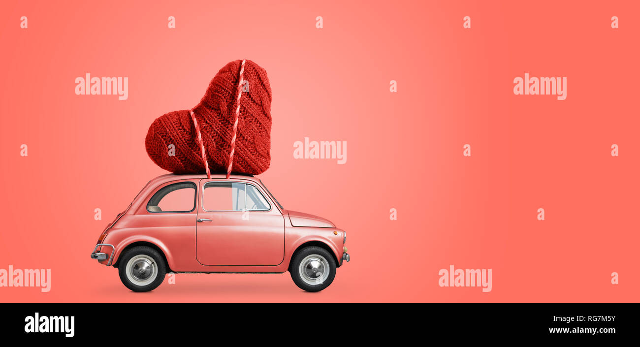 Toy car delivering heart Stock Photo - Alamy