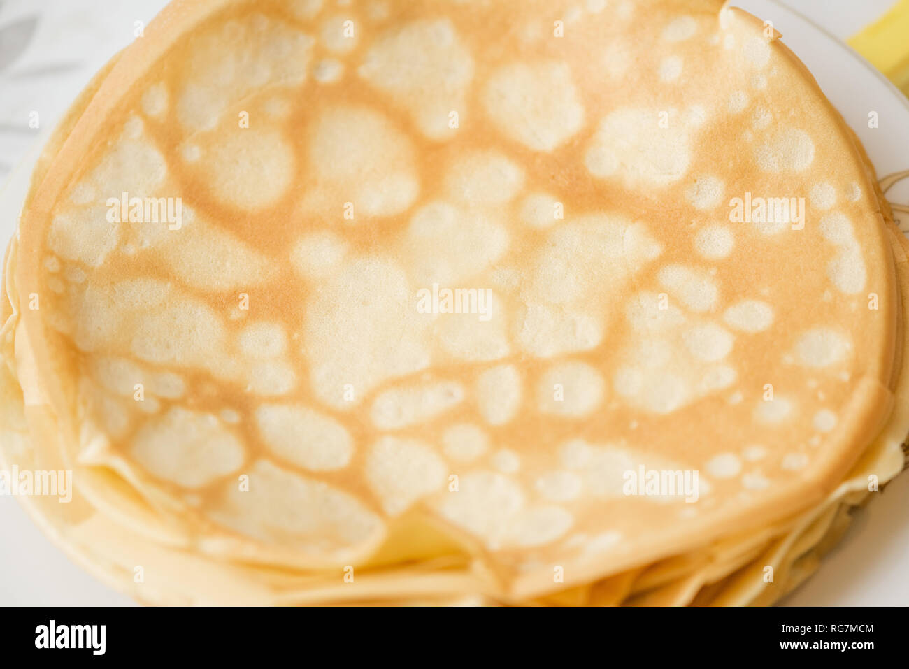 Round thin russian style yellow simple pastry close up Stock Photo - Alamy