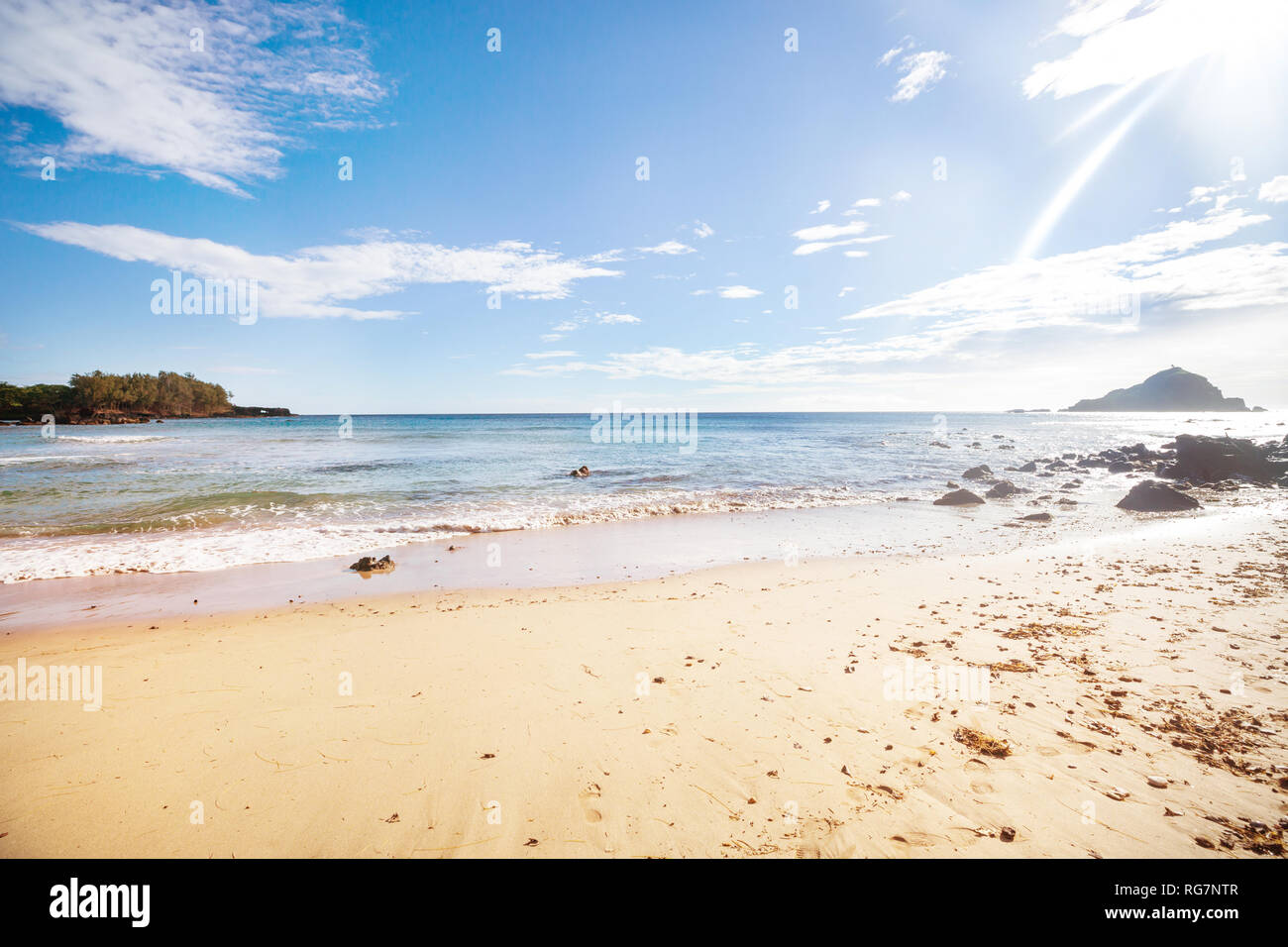 Amazing hawaiian beach. Wave in ocean at sunset or sunrise with surfer ...