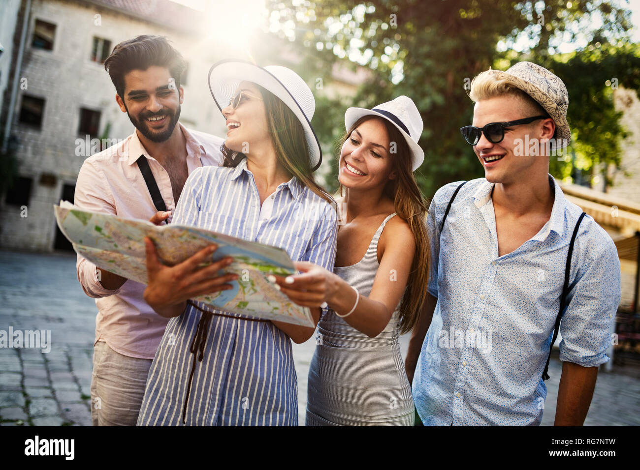 Group of happy friends enjoying sightseeing tour in the city Stock ...
