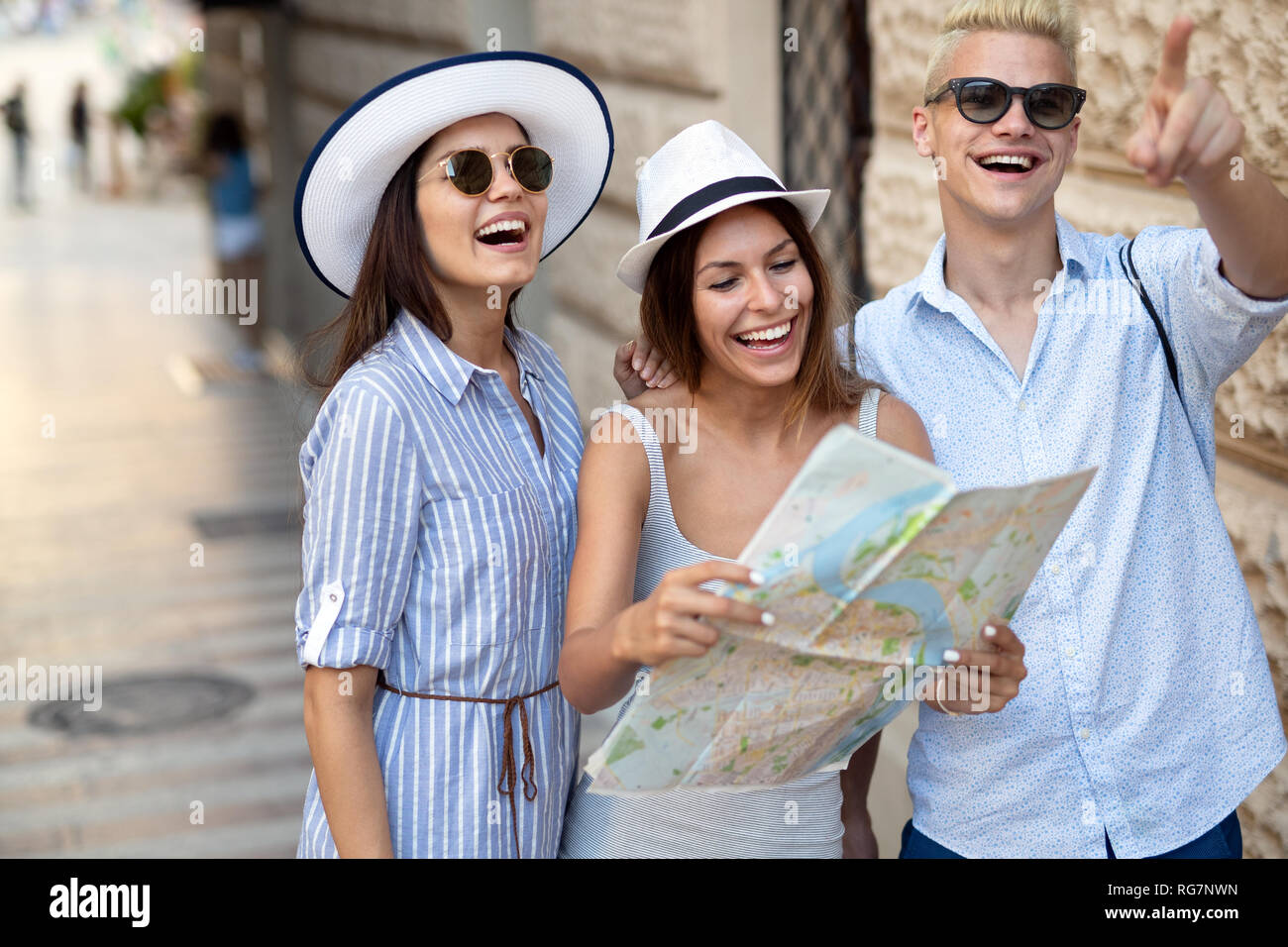 Group of happy friends enjoying sightseeing tour in the city Stock ...