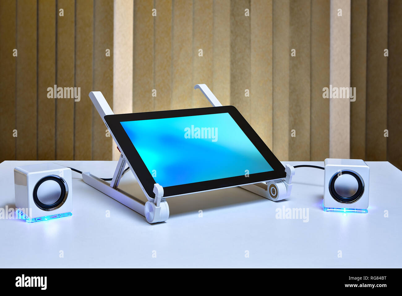 Tablet computer is connected to portable external speakers Stock Photo ...