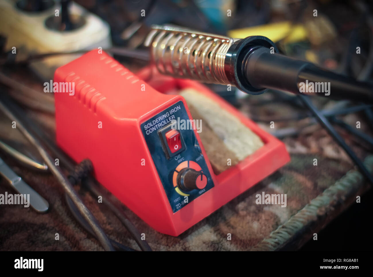 Soldering iron on the table Stock Photo - Alamy