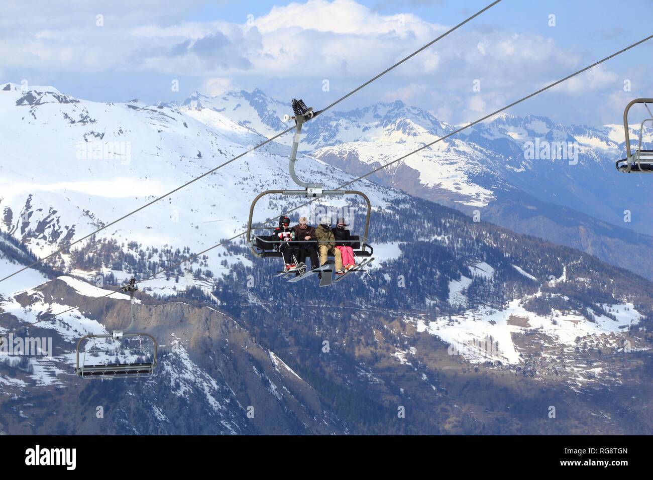 VALLOIRE, FRANCE - MARCH 24, 2015: Skiers go up the lift in Galibier ...