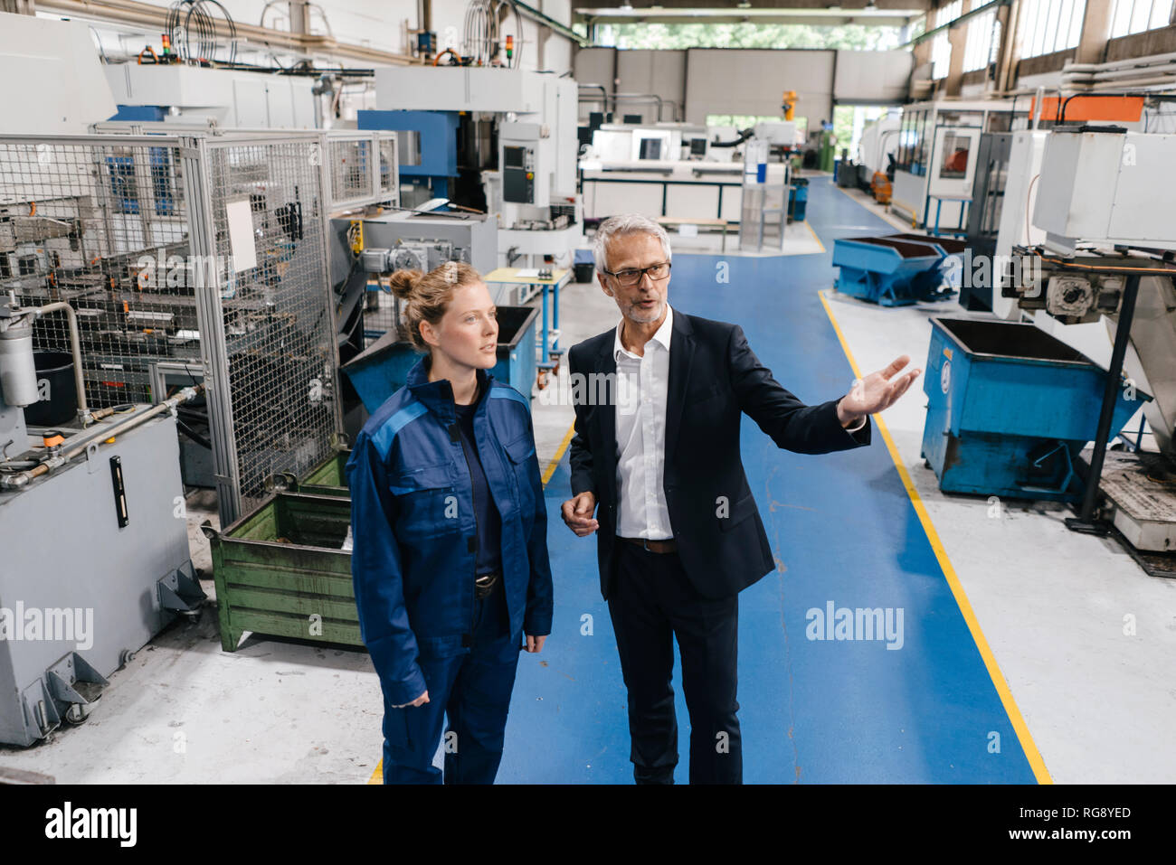 Manager and skilled worker of a high tech enterprise having a meeting ...