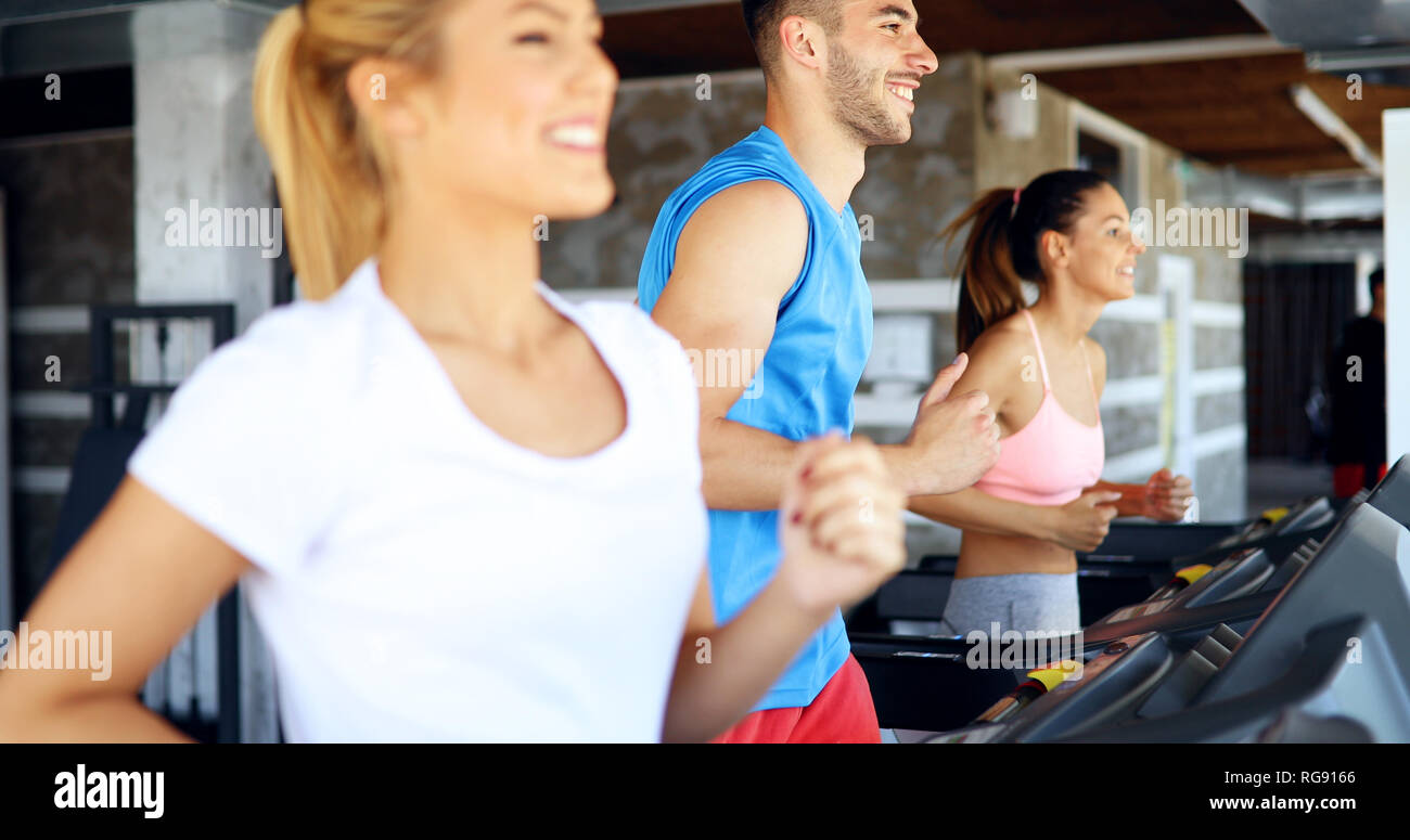 Picture of people running on treadmill in gym Stock Photo - Alamy