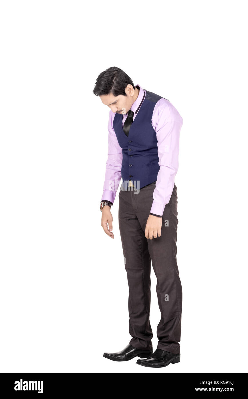 Portrait of tired asian businessman with head down posing isolated over ...