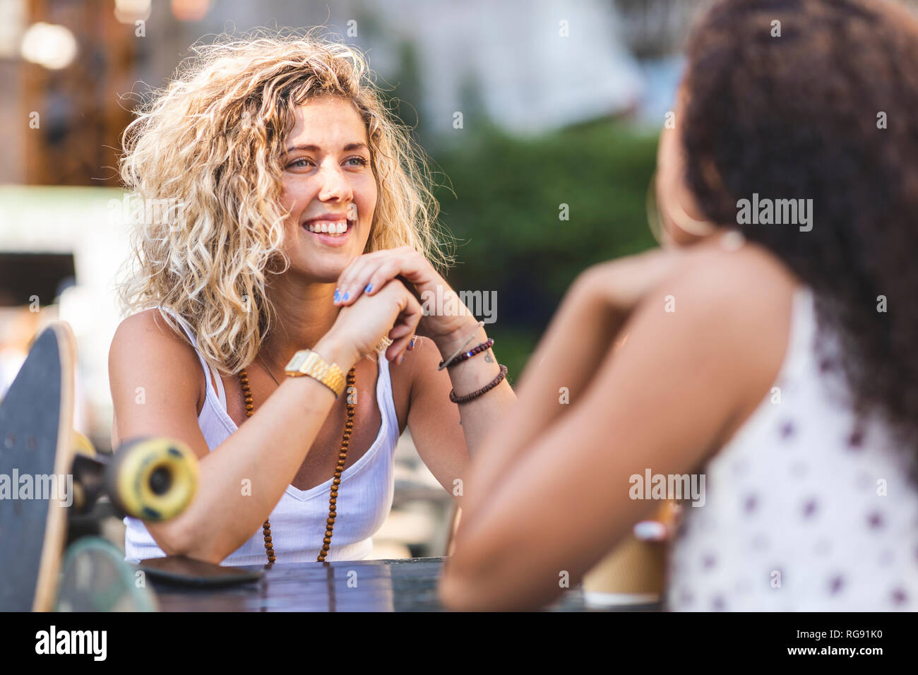 Two people facing each other talking hi-res stock photography and ...