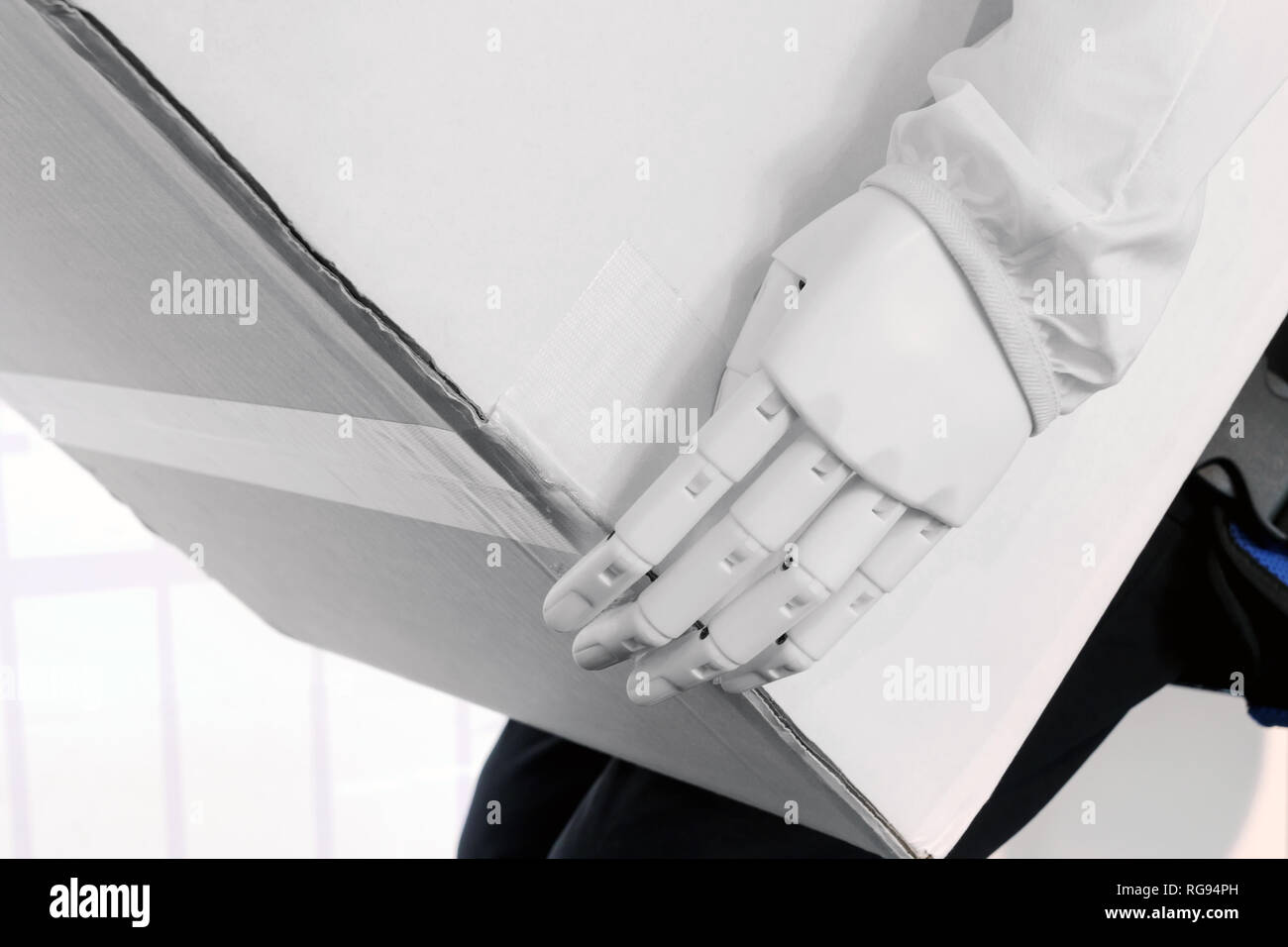 Robot arm carry heavy box. Robotic wearable muscle suit and artificial ...